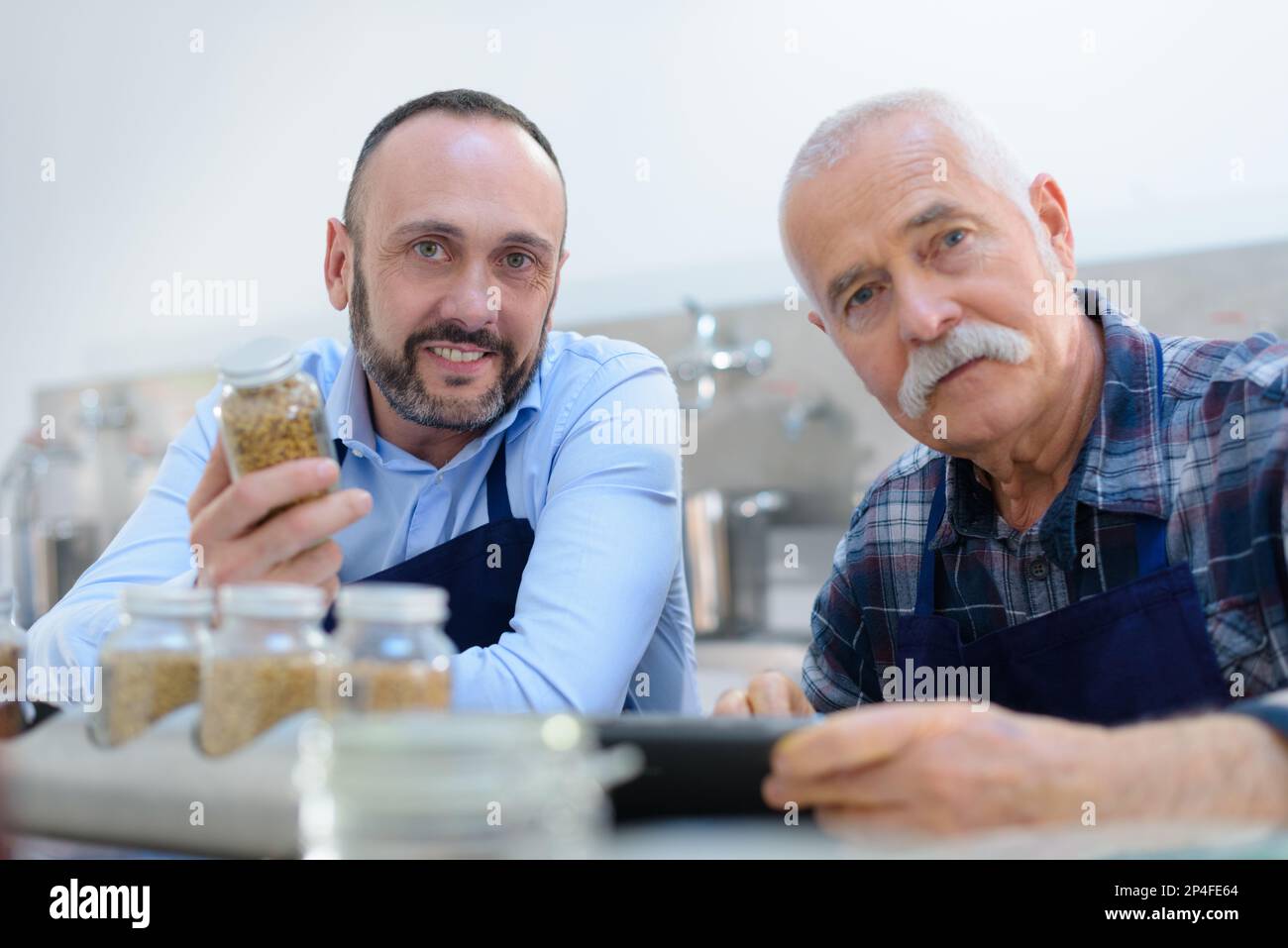 portrait of men showing seeds Stock Photo - Alamy