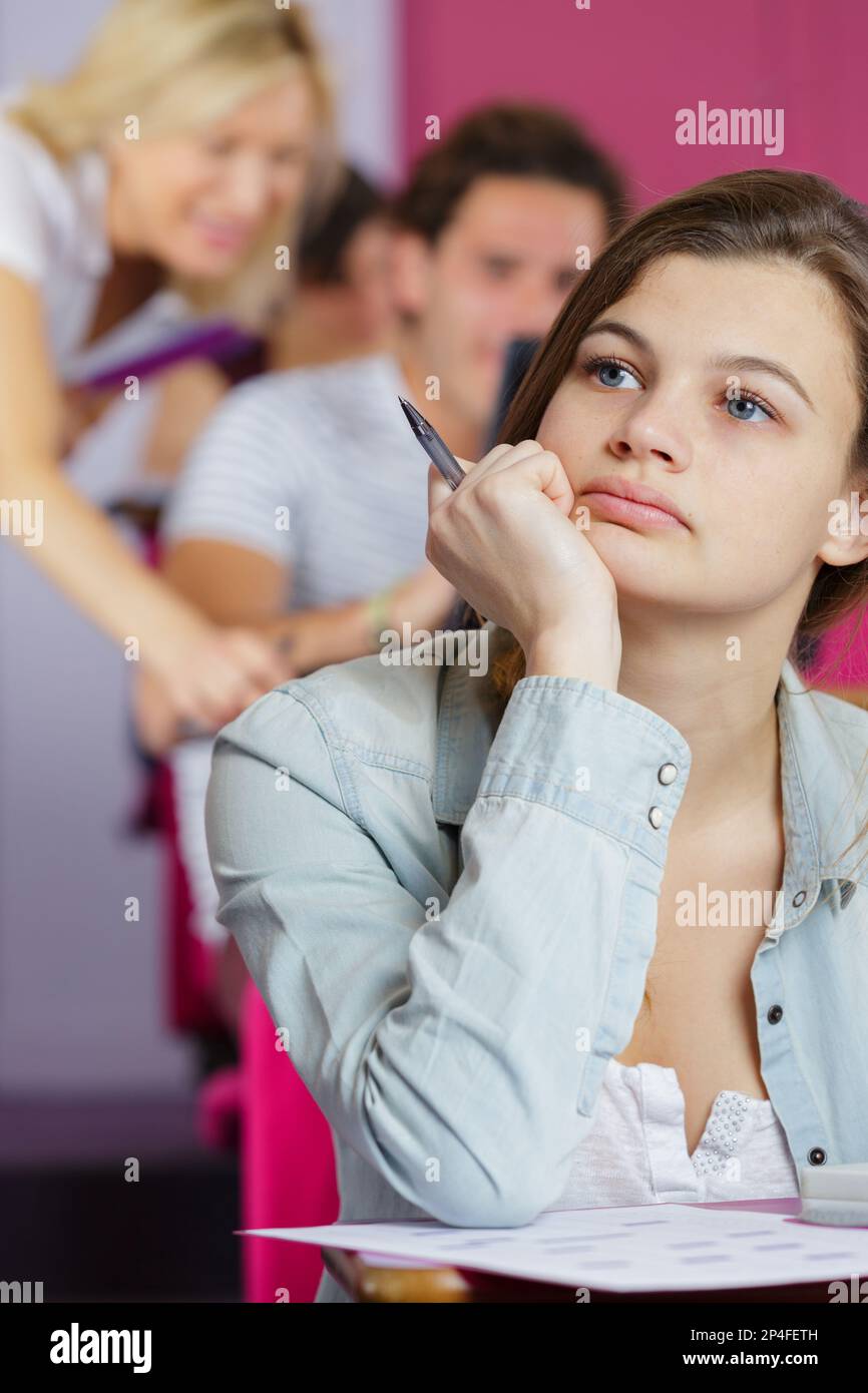 female student looking thinking in classroom Stock Photo - Alamy