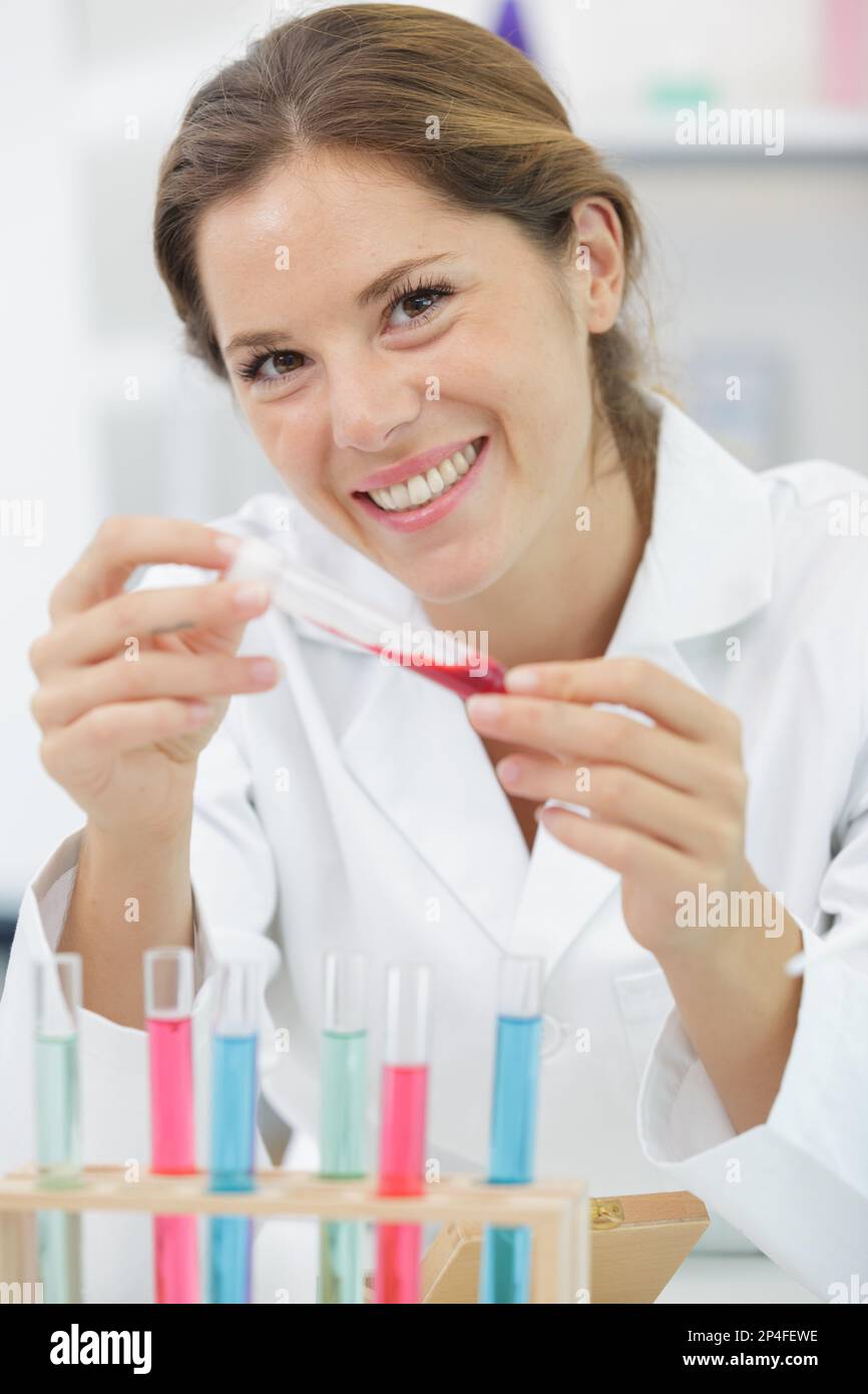 female scientist holding test tube Stock Photo - Alamy