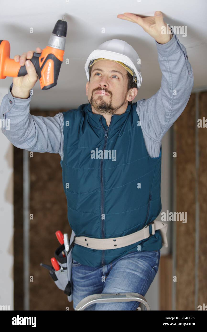 installing mounting clips for a corrugated wire with a cable Stock ...