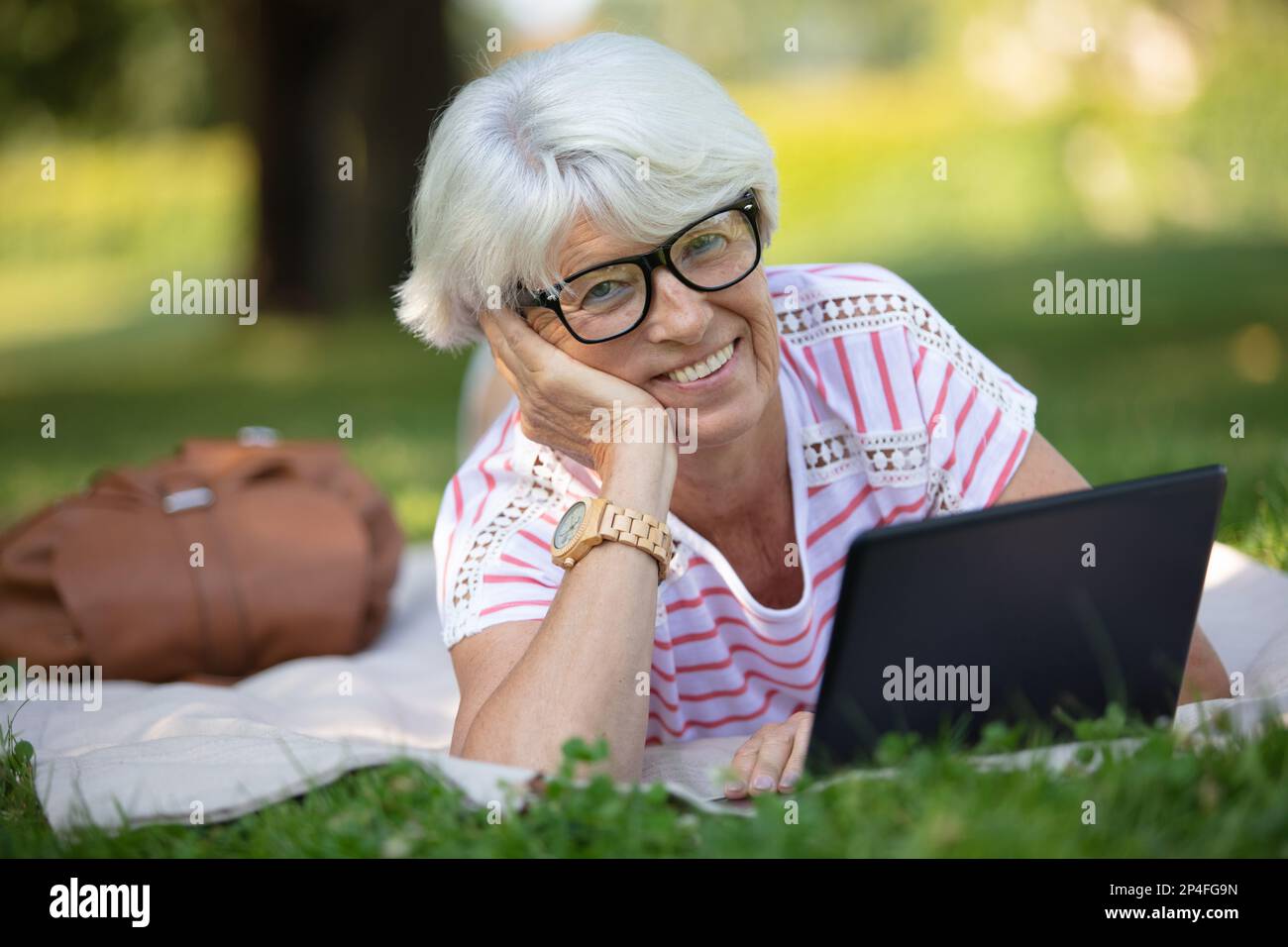 Middleaged woman with computer hi-res stock photography and images - Alamy