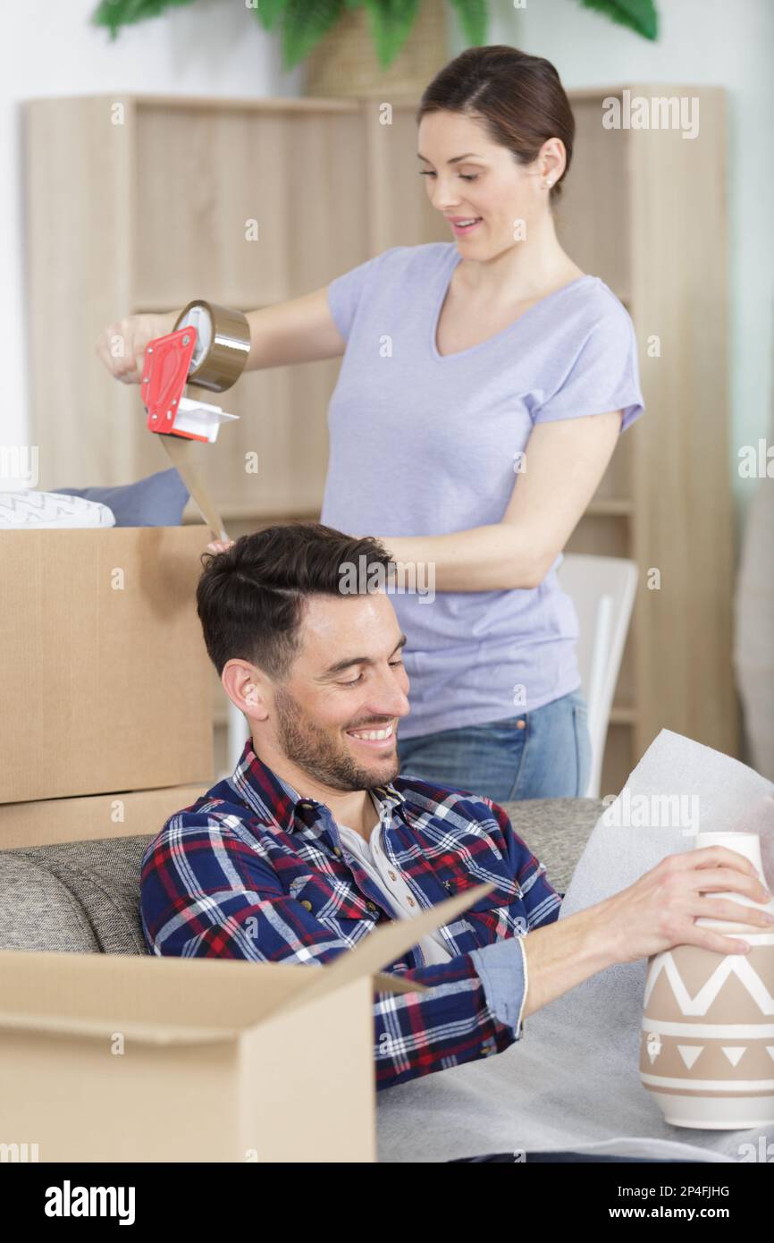 pregnant couple packing things in boxes Stock Photo - Alamy