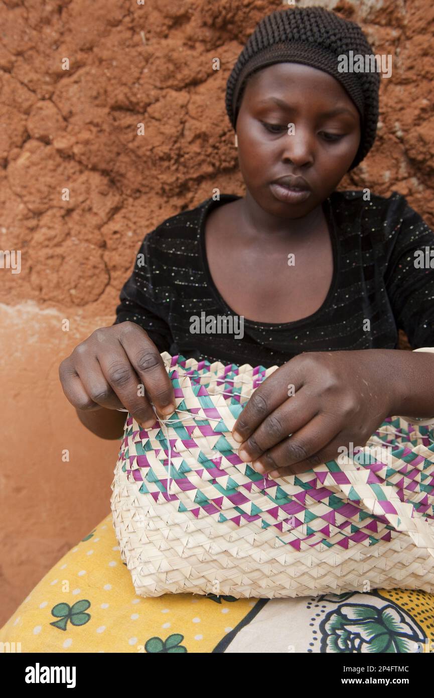 Basket maker, basket weaver, Lady weaving traditional basket, Rwanda ...
