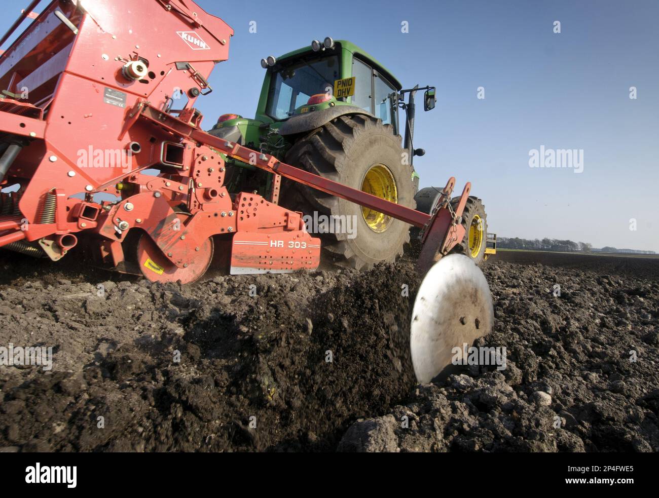 Tractor with seeder, sowing Westminster spring barley, Pilling ...