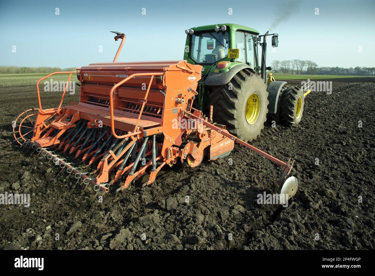 Tractor with seeder, sowing Westminster spring barley, Pilling ...