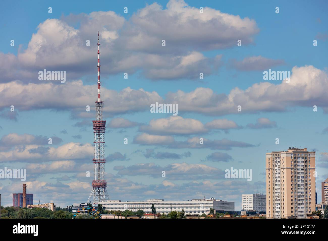 Kyiv TV tower in a summer cityscape against a cloudy sky, Kyiv, Ukraine ...