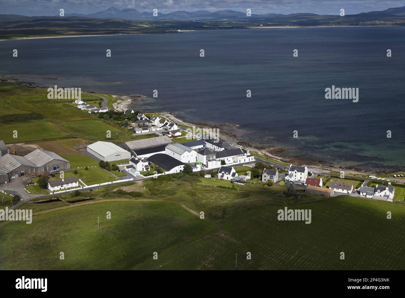 Aerial view of coastline with village and whisky distillery ...