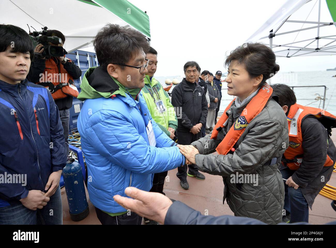 South Korean President Park Geun-hye, right, consoles a relative of a passenger aboard the ...