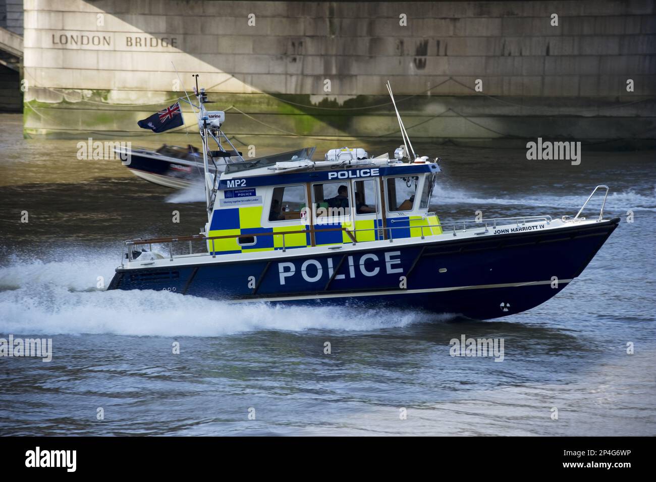 Police patrol boat patrolling city river, London Bridge, River Thames ...
