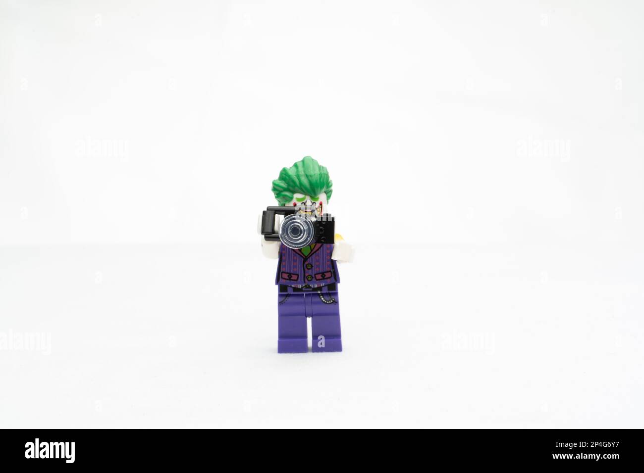 LEGO-character Joker holds camera isolated white background Stock Photo ...