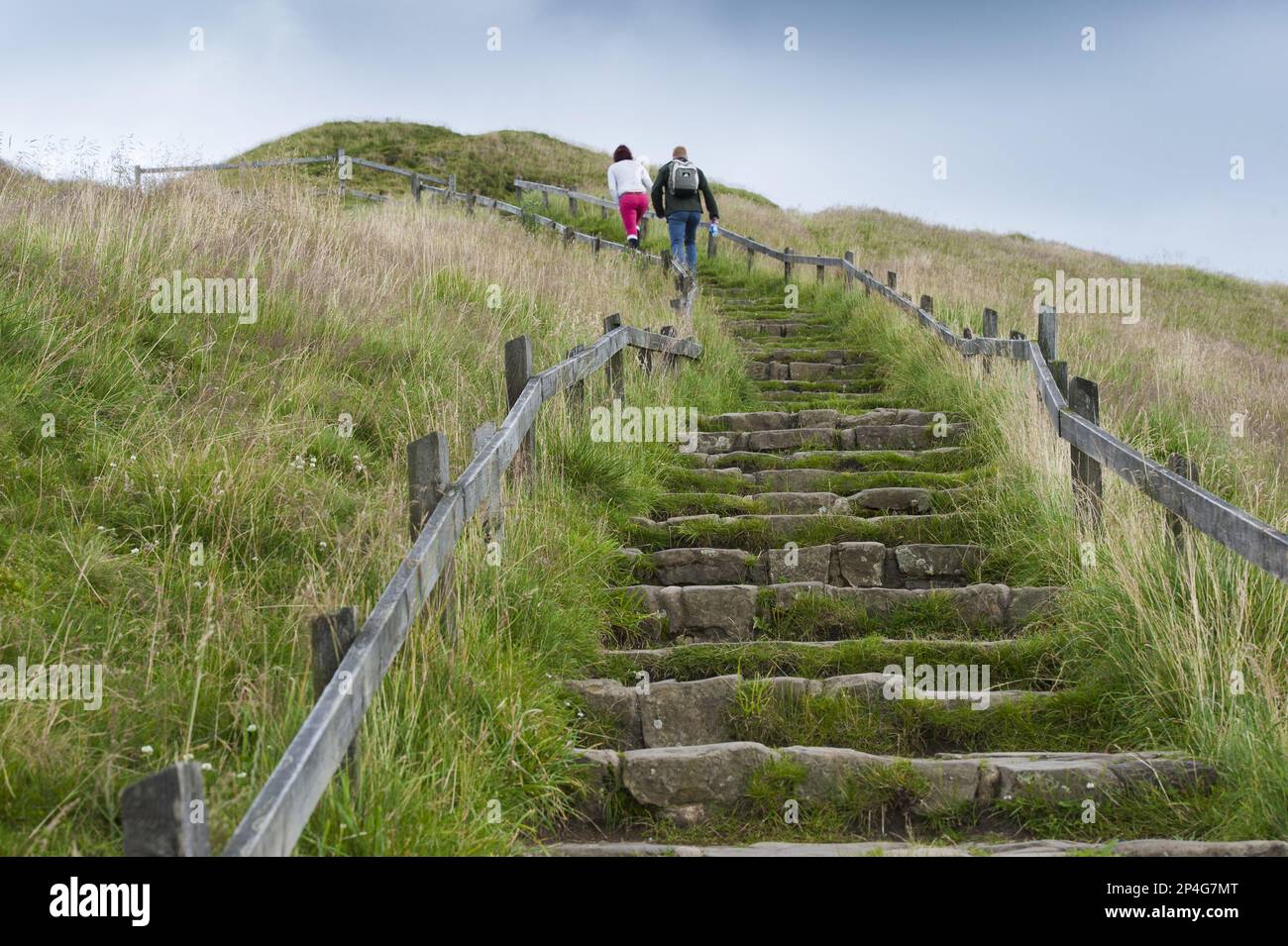 Walkers walking up steps, on limestone path to protect against soil ...