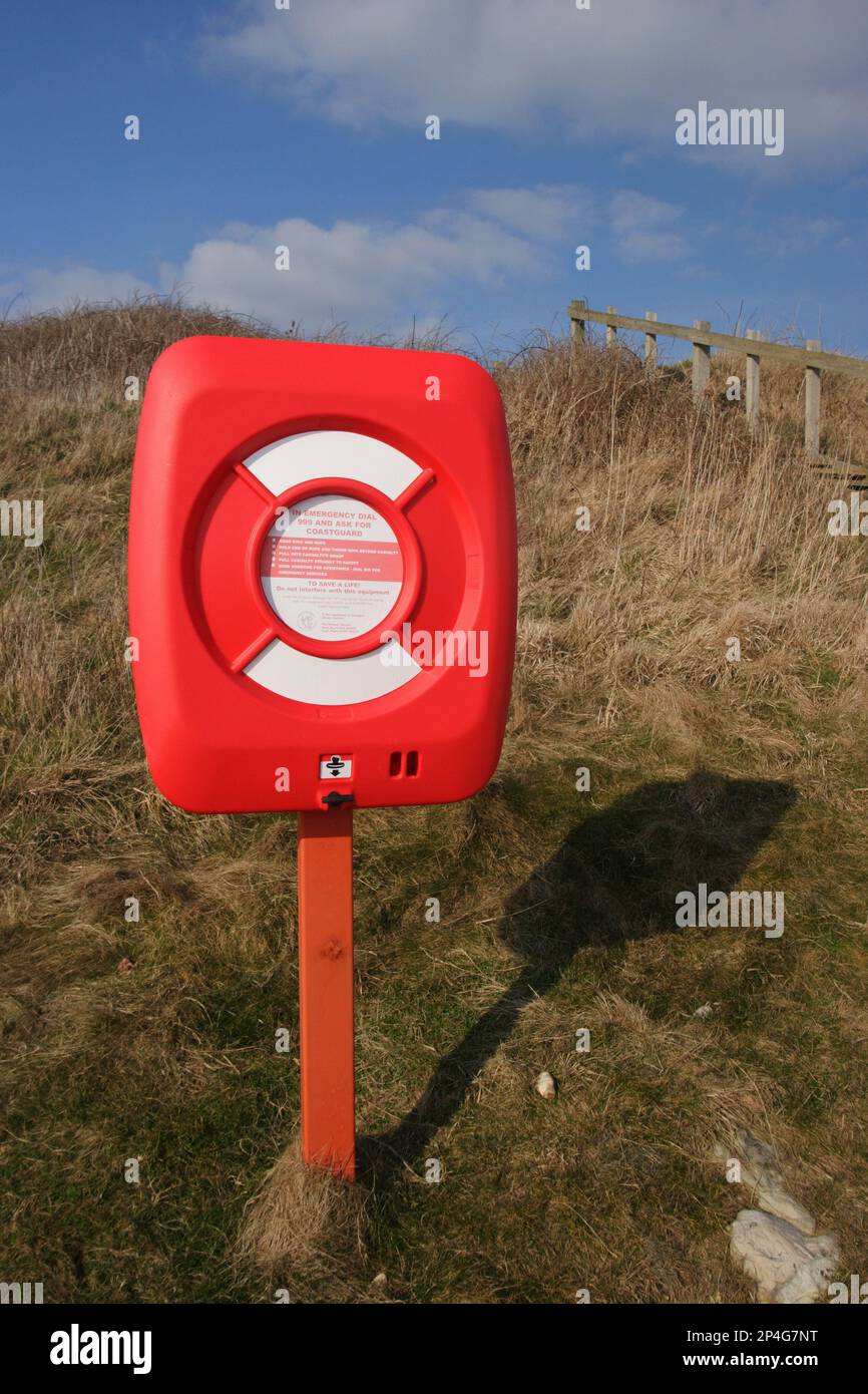 Lifebuoy in container on beach, Ringstead Bay, Dorset, England, United ...