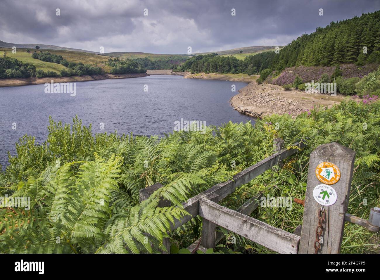 View of manmade reservoir with 'Holme Valley Riverside Way' and ...