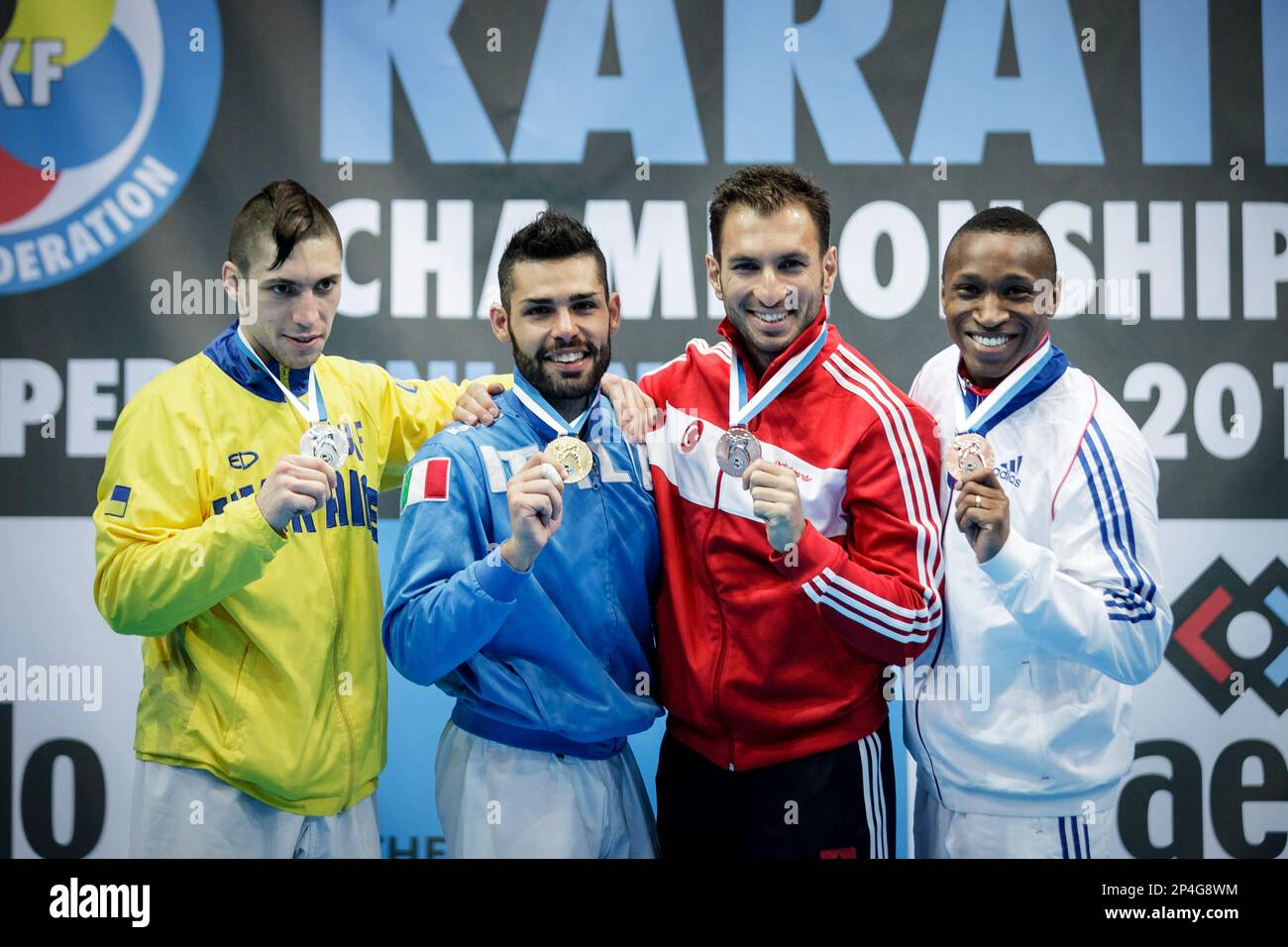 Winners of men's Kumite -75kg competition, from left, silver medalist ...