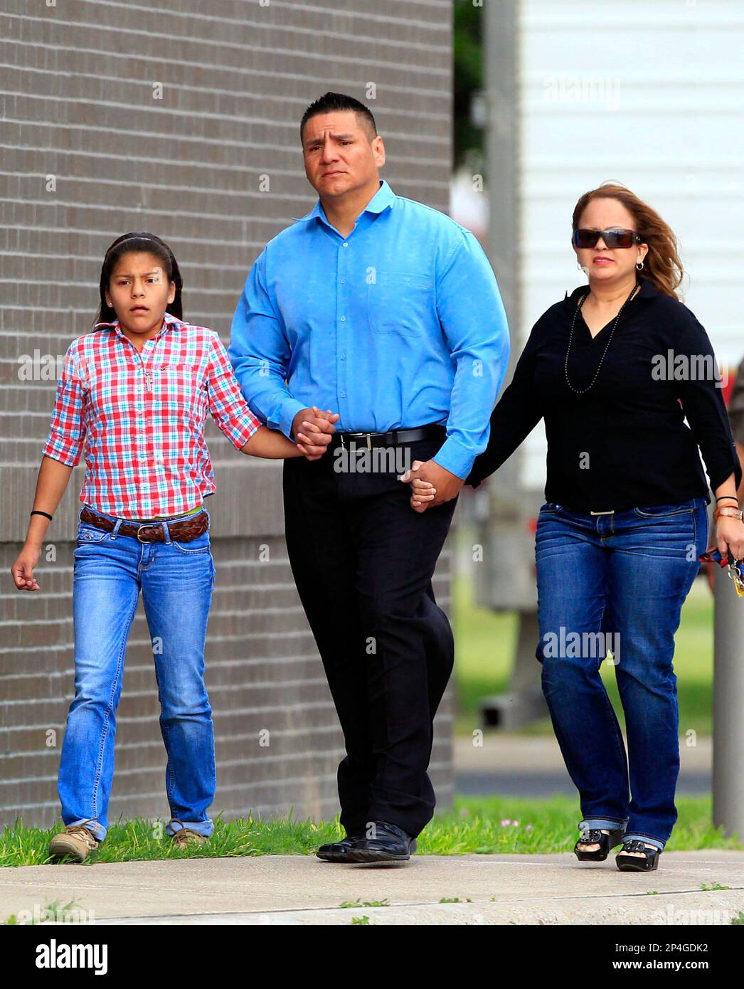 Salvador Arguello walks with his family to the Bentsen Tower as he ...