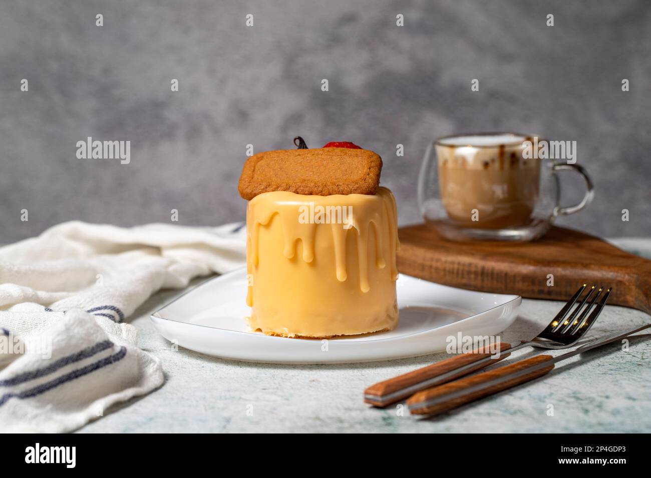 Caramel and biscuit cake. Patisserie products. Liquid caramel cake on a ...