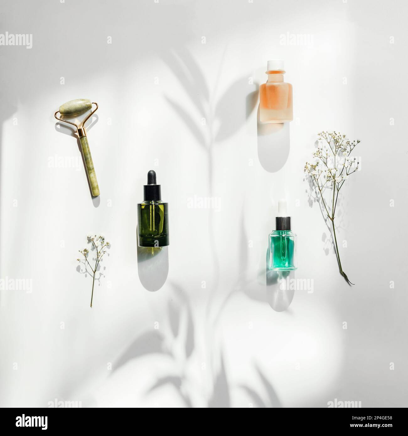 Modern skin care cosmetic on white background with sunlight and shadow ...