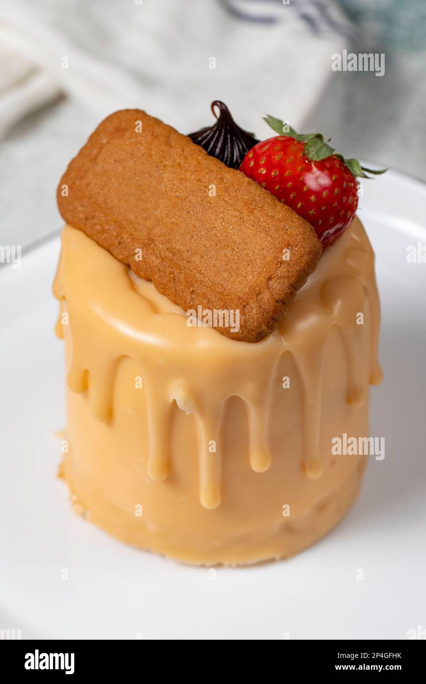 Caramel and biscuit cake. Patisserie products. Liquid caramel cake on a ...