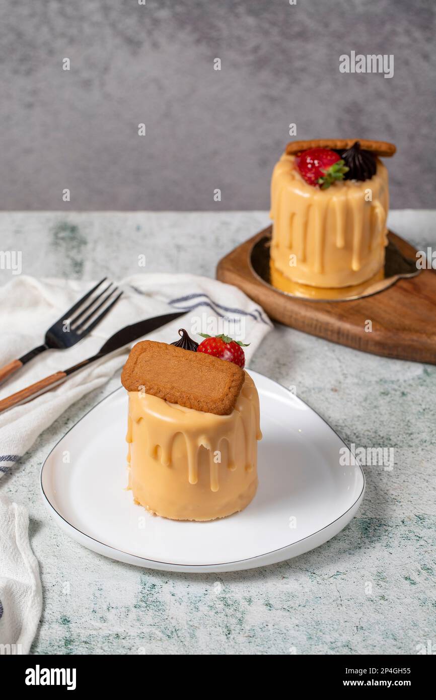 Caramel and biscuit cake. Patisserie products. Portion liquid caramel ...