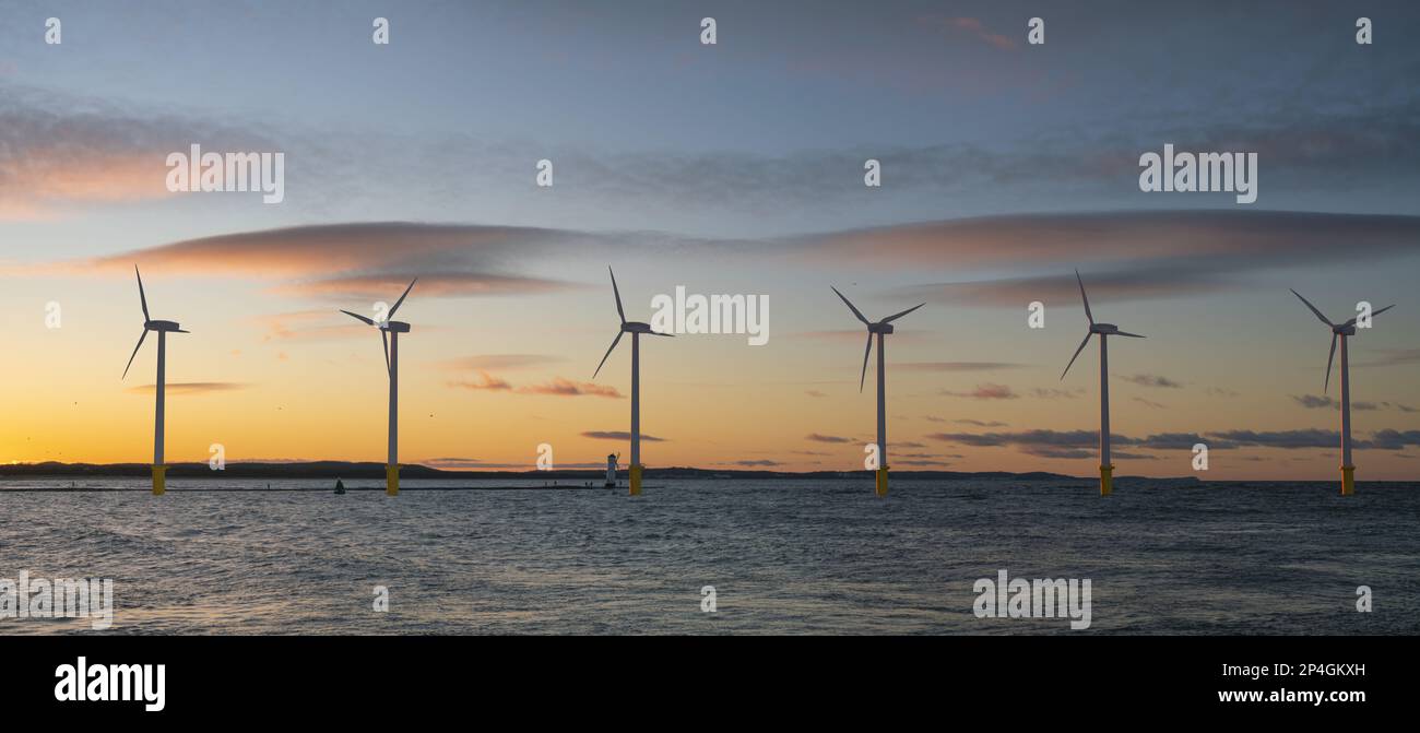 Offshore wind farm during sunset Stock Photo - Alamy