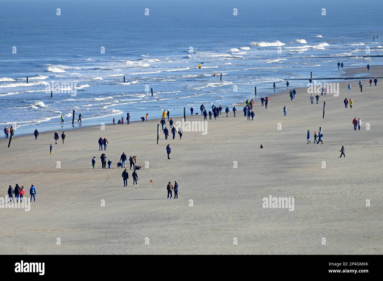 View over the North Beach with beach walkers, North Sea with waves ...