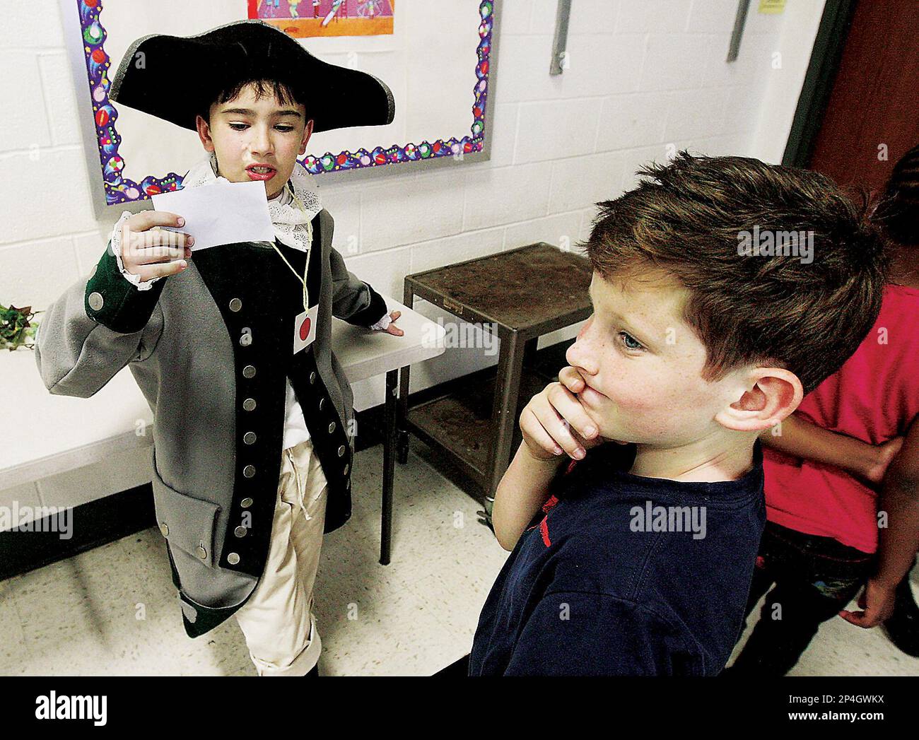 Dylan Adams, 7, right, a second grade student at Gilson Brown School in ...