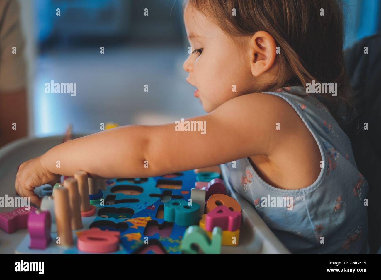 Cute little baby girl learning numbers through game. Activity with ...