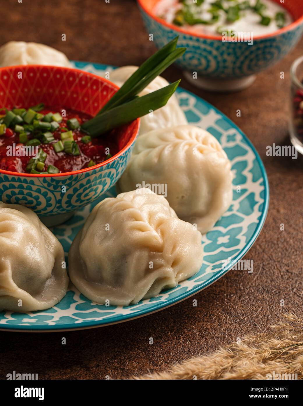 Portion of steamed tatar manti dumplings Stock Photo - Alamy