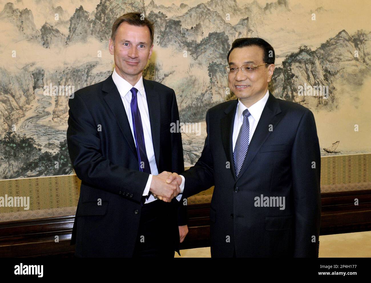 Chinese Premier Li Keqiang, right, shakes hand with Britain's British ...