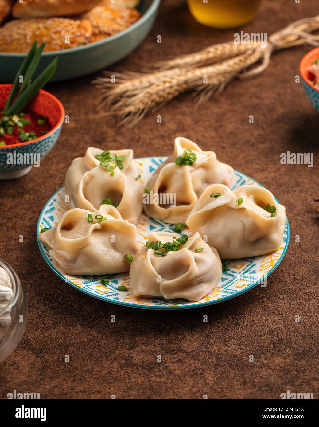 Portion of steamed tatar manti dumplings Stock Photo - Alamy