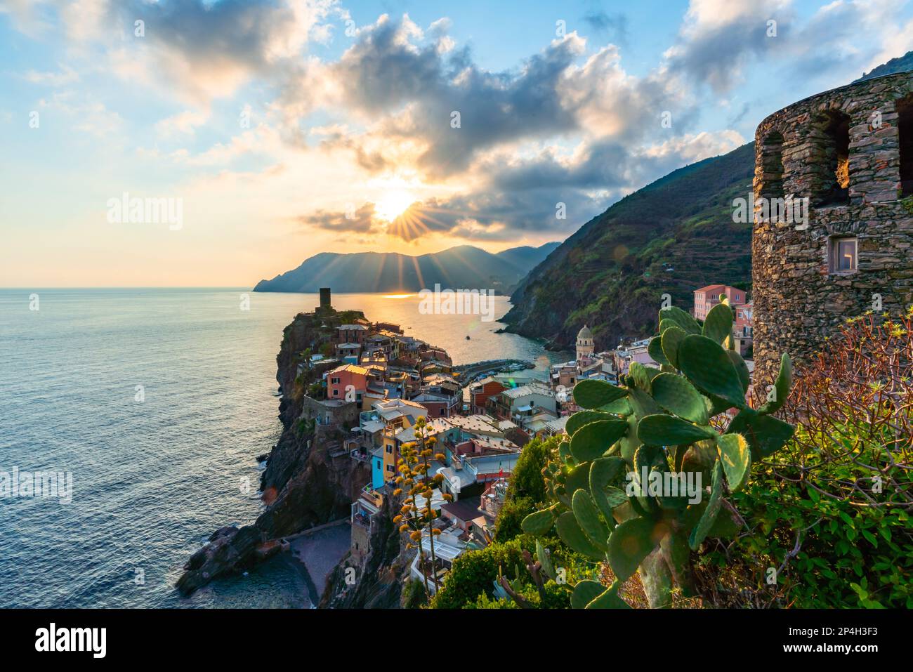Scenic View over Vernazza in Italy with colorful city, sun and ocean ...