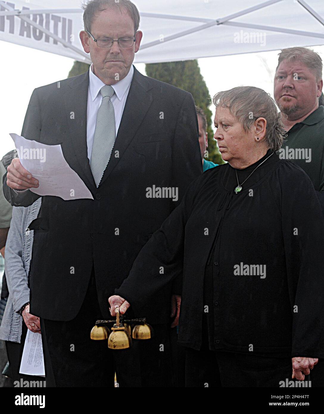 Pastor Lloyd Johnson of the Utica Baptist Church reads the names of all ...