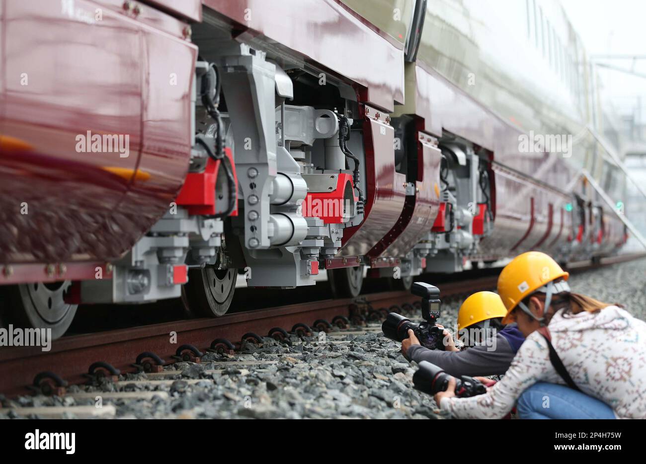 Reporters take a phots of a third-generation of Free Gauge Train, Gauge Convertible Train, a ...