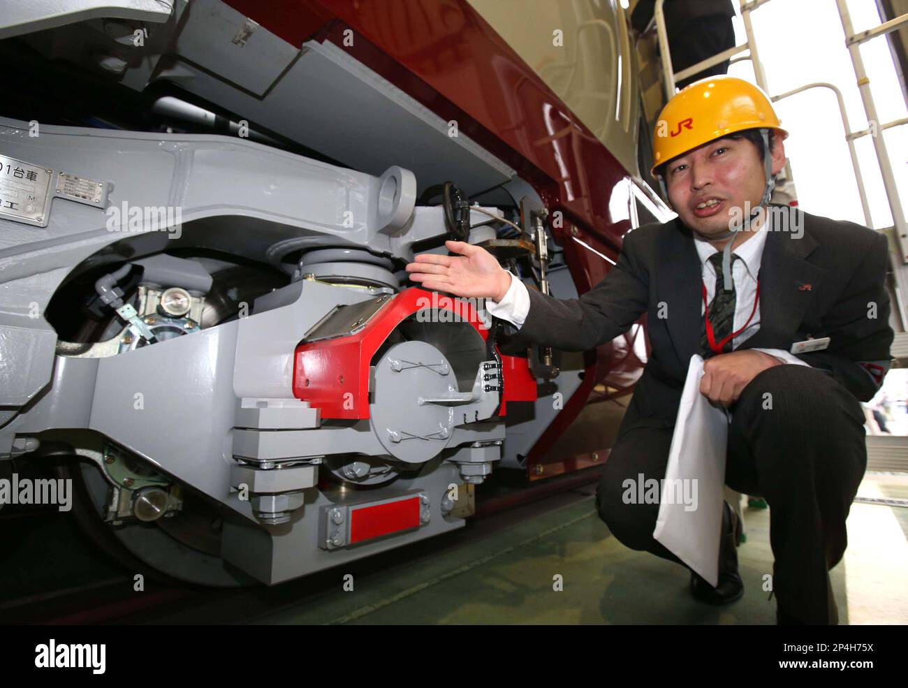 A official of the JR Kyushu explains about Gauge Convertible Train, a ...