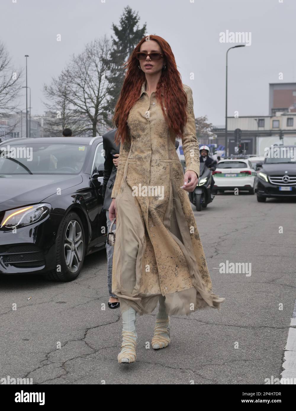 Fashion blogger posing for photographers before Diesel fashion show ...