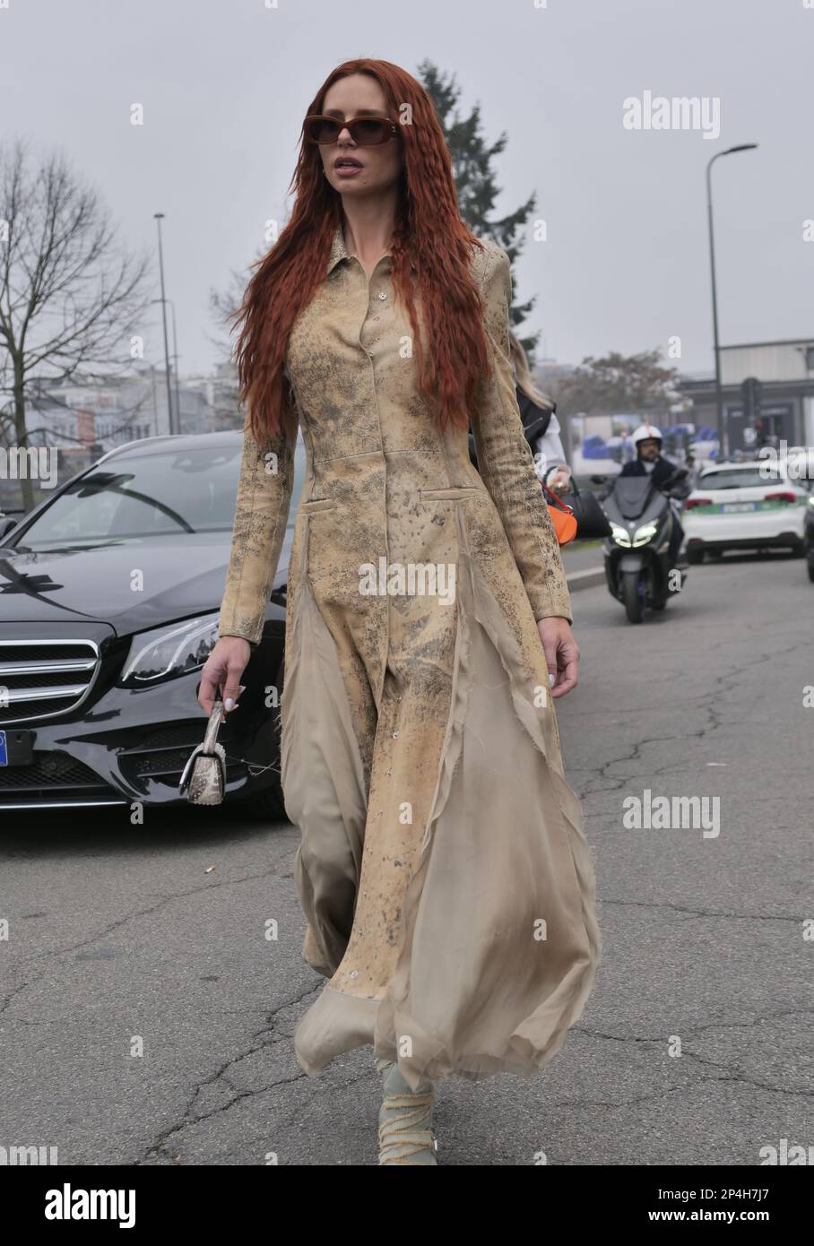 Fashion blogger posing for photographers before Diesel fashion show ...