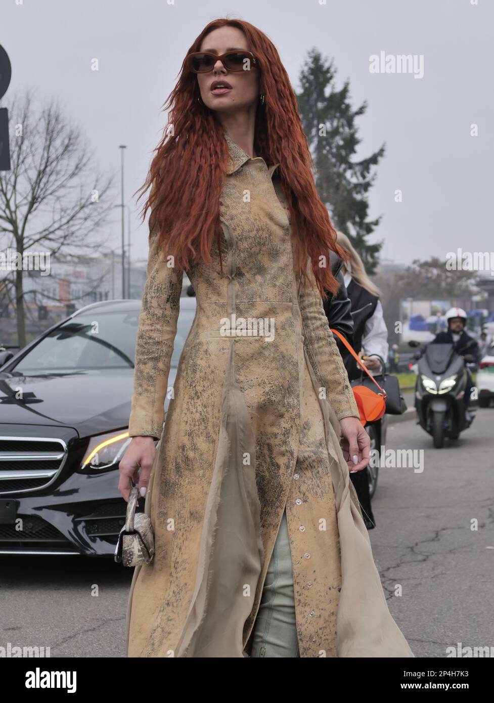 Fashion blogger posing for photographers before Diesel fashion show ...