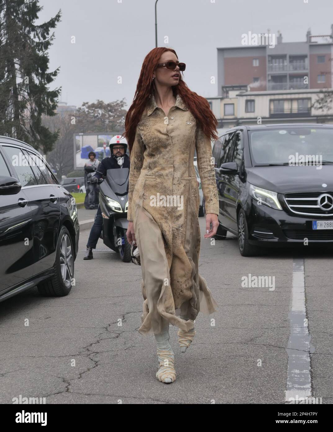 Fashion blogger posing for photographers before Diesel fashion show ...