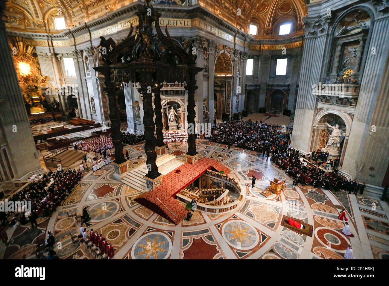 Pope Francis lays prostrate on the floor in prayer before presiding ...