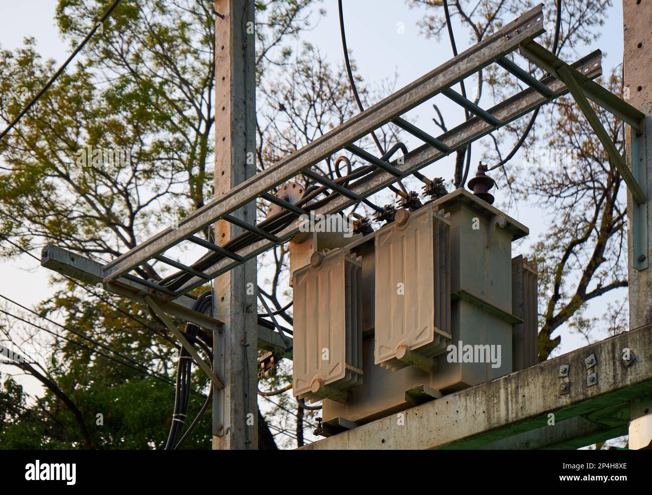 The electric transformer on the rack Stock Photo - Alamy