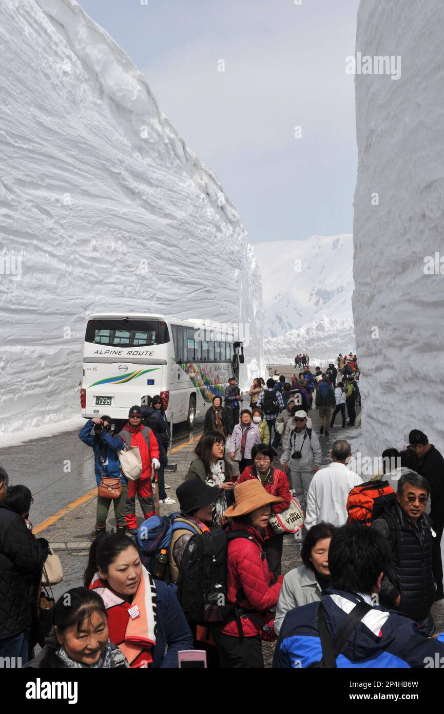 People enjoy viewing the 15-meter snow walls of the Yuki no Otani ...
