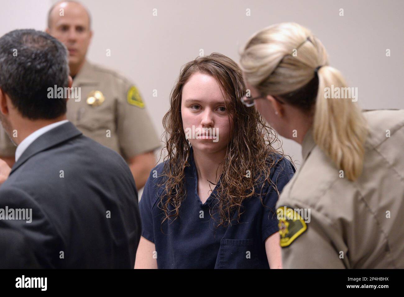 Meagan Grunwald, center, enters court for her preliminary hearing ...