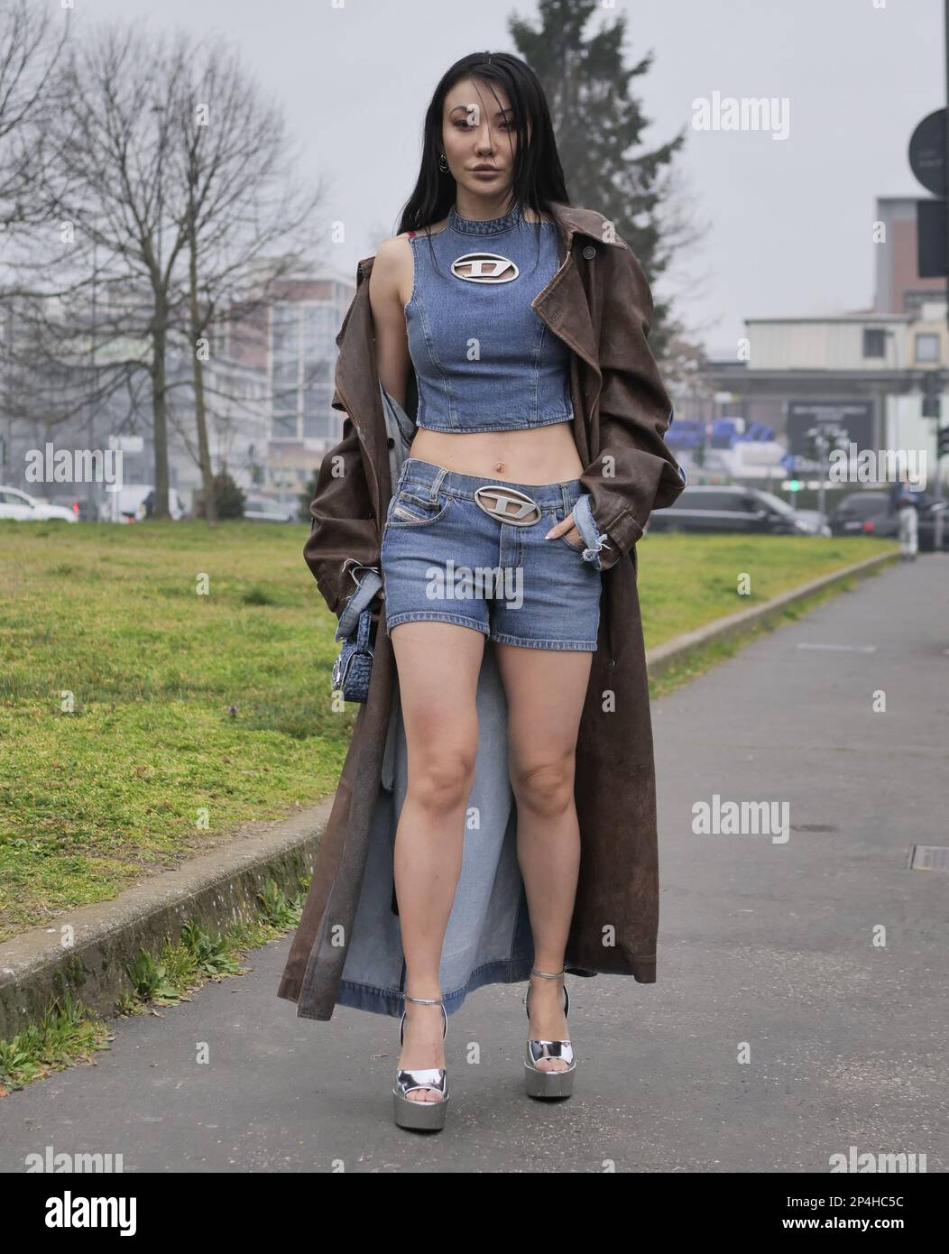 Fashion blogger posing for photographers before Diesel fashion show ...