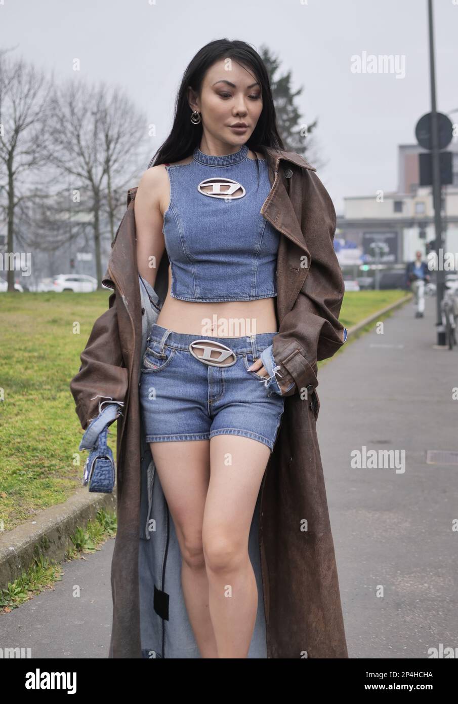 Fashion blogger posing for photographers before Diesel fashion show ...