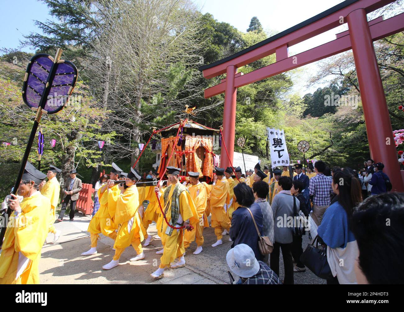 Shrine parishioner, wearing Heian period costumes, carry a portabl ...