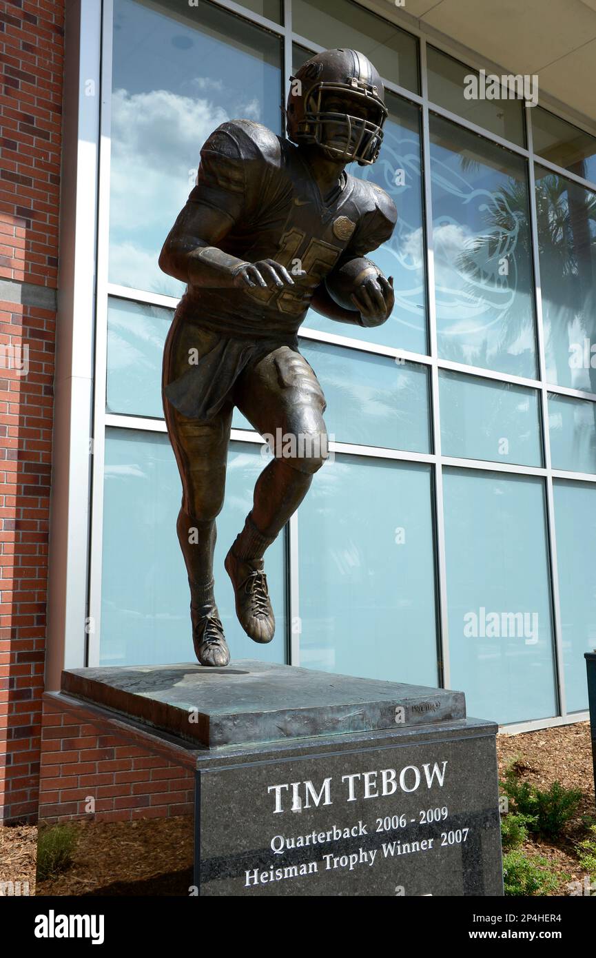 A statue of Tim Tebow stands among three statues of former Florida ...