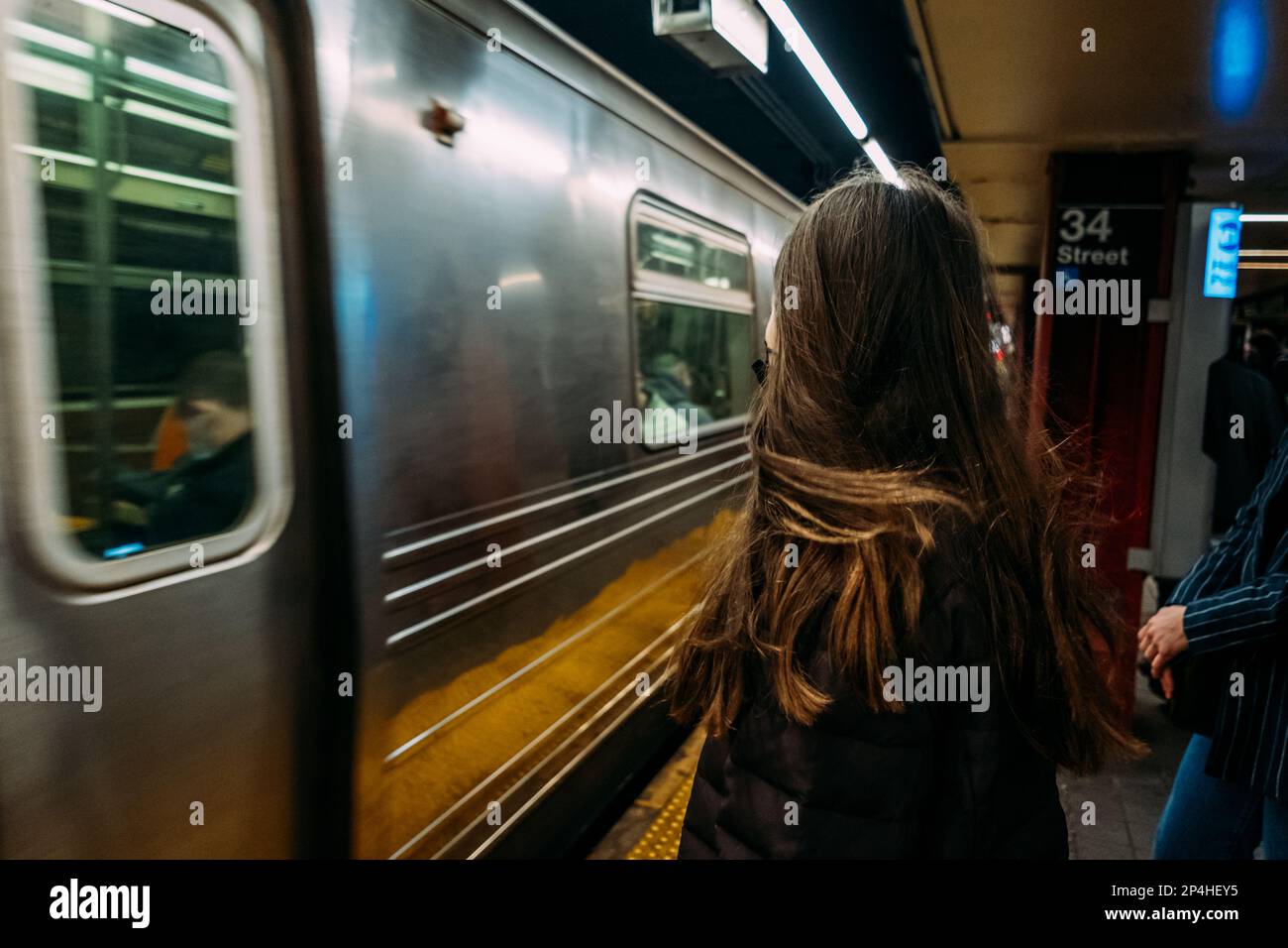 Woman standing train hi-res stock photography and images - Alamy