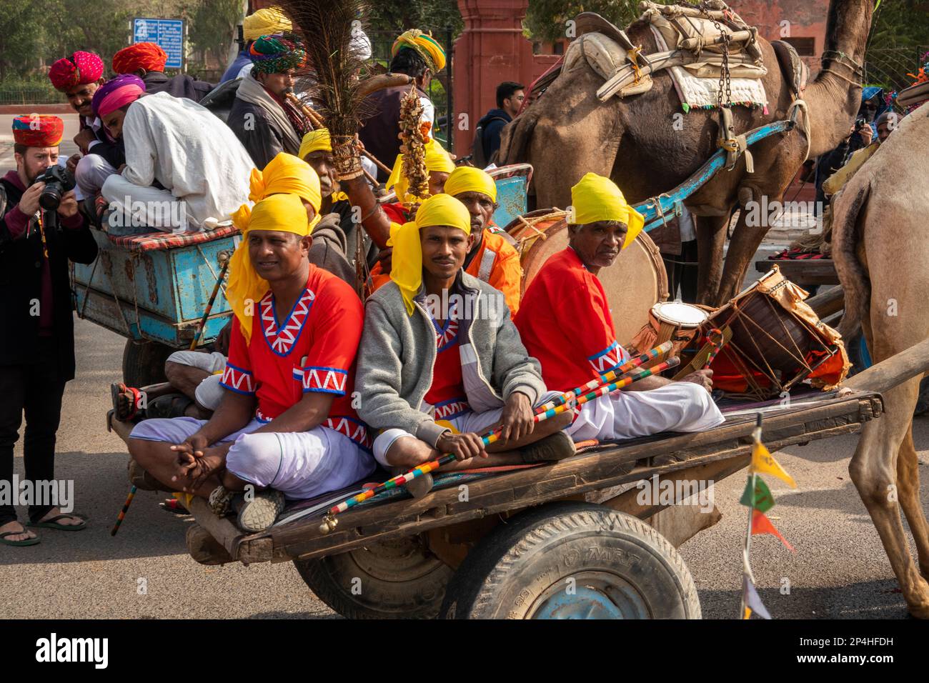 India, Rajasthan, Bikaner, Camel Festival Parade, men on camel-pulled ...