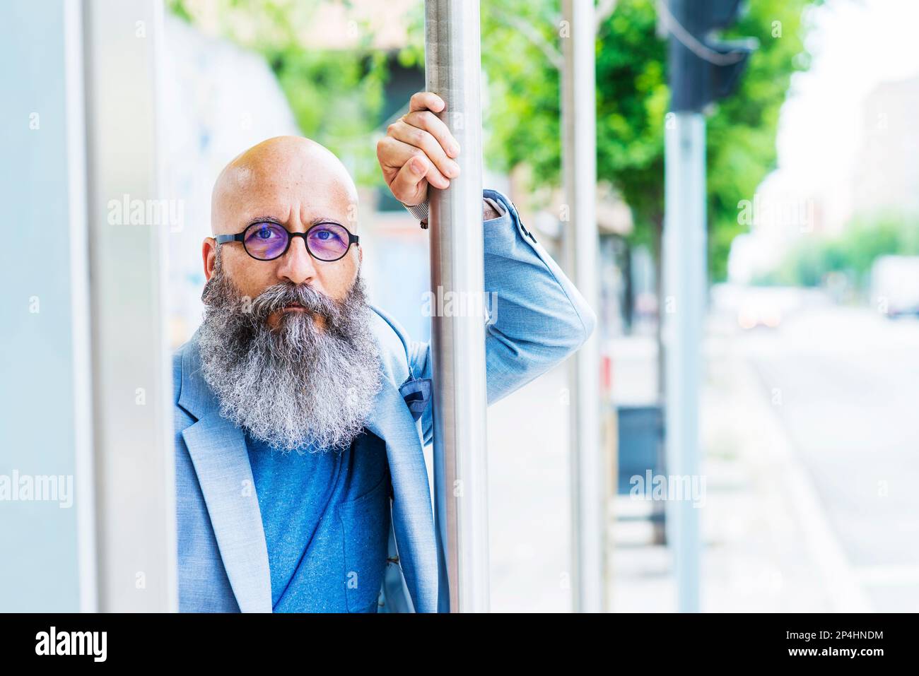 Hispanic Middle Aged Bald Bearded Bearded Man Standing Leaning On