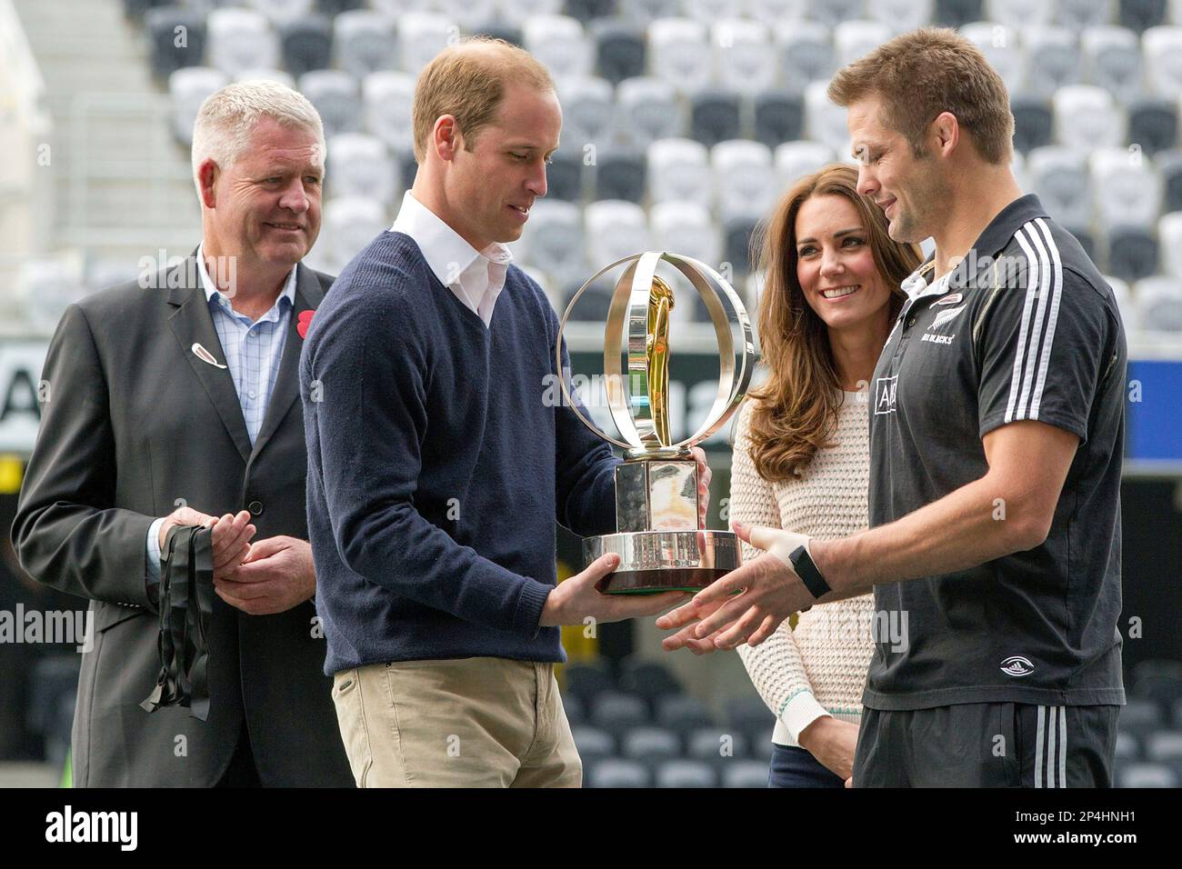 Watched by NZ Rugby CEO Steve Tew, left, Britain's Prince William hands ...